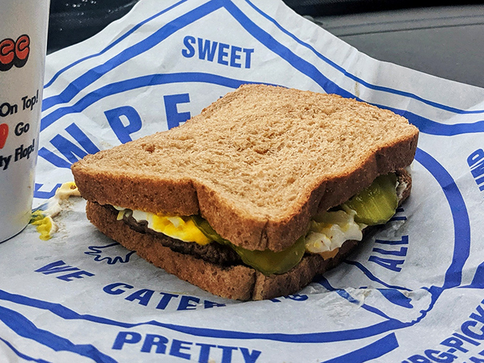 The sandwich that launched a thousand road trips, nestled in its paper wrapper like the comfort food equivalent of a love letter.