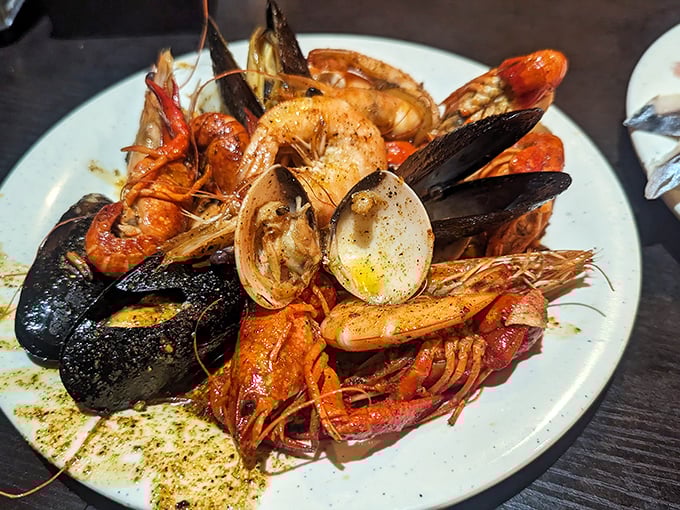 A seafood lover's dream plate &ndash; mussels, shrimp, and clams mingling like old friends at a delicious reunion. The ocean called; it wants to know why you're having all the fun.