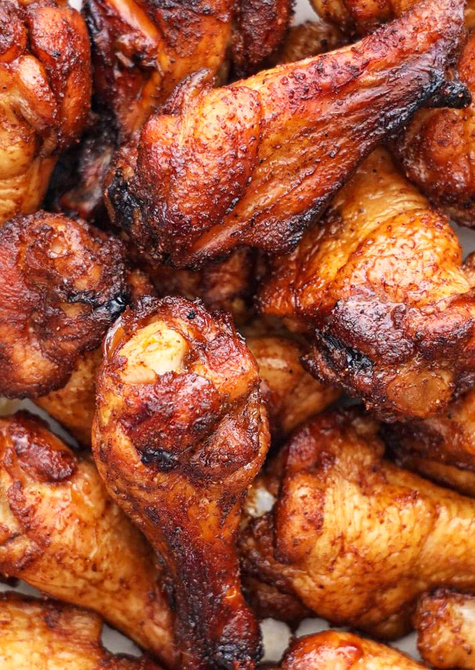 These chicken wings aren't just cooked &ndash; they're transformed. That mahogany skin promises a crunch that'll make your knees buckle with joy.