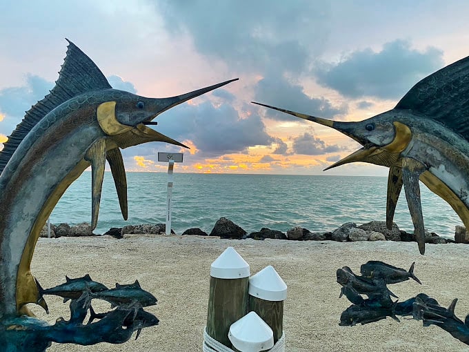 These sailfish sculptures stand guard over the water, as if saying, "Our friends inside are delicious, but we're just for show."
