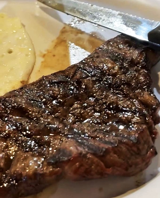 This steak isn't just cooked—it's been persuaded, over an open flame, to become its best possible self.