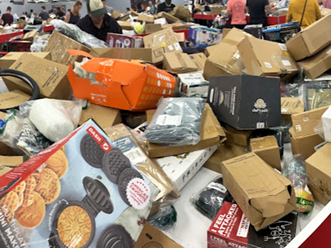 A close-up reveals the delightful jumble of potential treasures. That waffle maker might be someone's breakfast revolution waiting to happen.