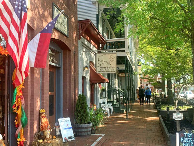 Strolling these brick sidewalks feels like walking through a Norman Rockwell painting where every shop window invites you to peek inside.