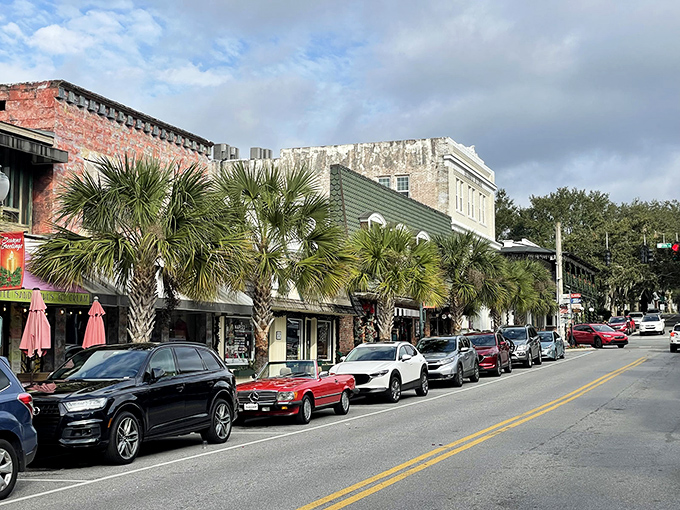 Palm trees frame historic buildings along Mount Dora's downtown strip, where brick facades and awnings create a streetscape that's remained delightfully unchanged.