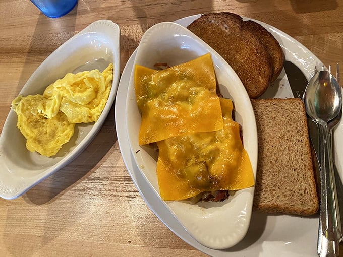 Eggs, perfectly toasted bread, and those legendary hash browns sharing a plate with bacon. This isn't just breakfast&mdash;it's edible therapy for whatever ails you.