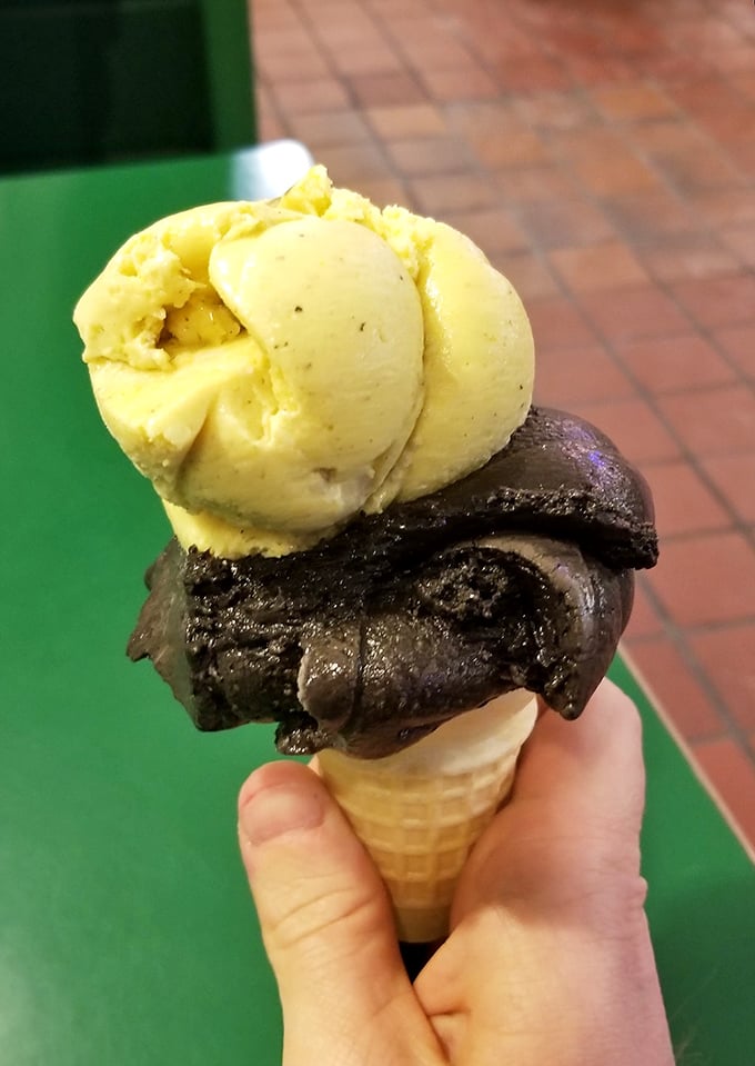 A perfect scoop marriage: dark chocolate intensity meets sunny yellow sweetness in a cone that deserves its own Instagram account. 