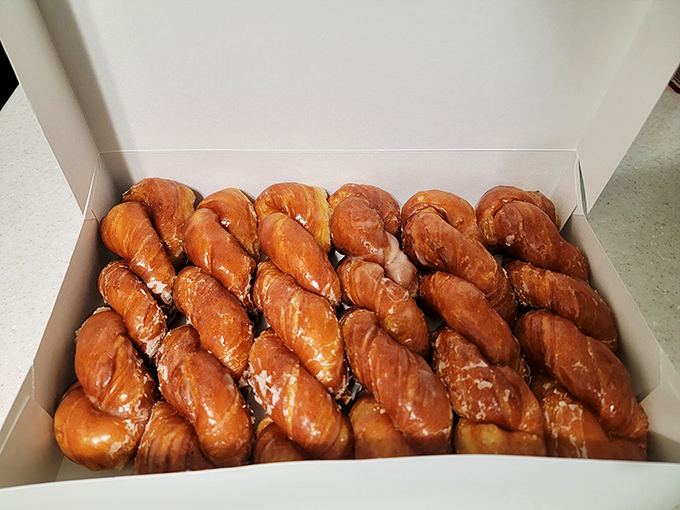 Perfectly twisted cinnamon rolls lined up like soldiers, ready to sacrifice themselves for your breakfast pleasure.