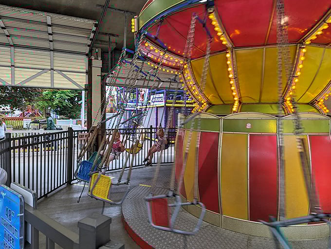 The Wave Swinger spins its colorful seats in a kaleidoscopic blur, offering riders that perfect mix of thrill and boardwalk breeze.