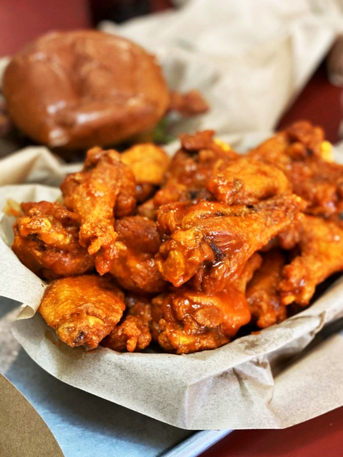These wings aren't just orange&mdash;they're practically glowing with flavor potential, like tiny edible beacons of Buffalo-sauced joy.