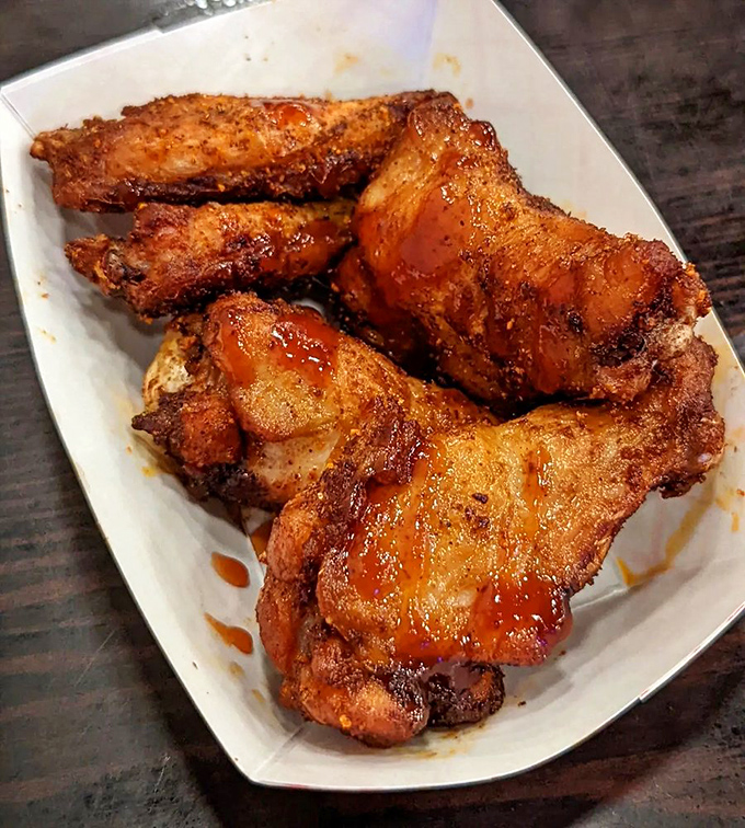 Wings that have clearly graduated from the school of "why settle for ordinary?" Crispy, saucy, and ready for their close-up on your Instagram feed.