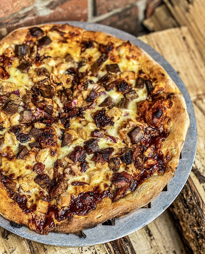 Pizza and barbecue had a beautiful baby. The wood-fired crust cradles smoky meat like it was destiny, not culinary fusion.