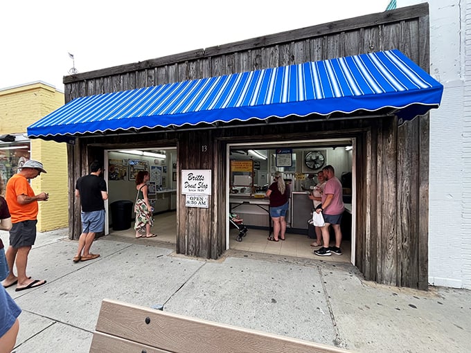 Britt's blue awning signals donut paradise on Carolina Beach's boardwalk. Simple shop, legendary glazed perfection.