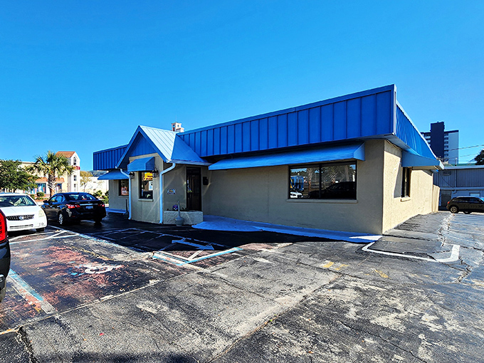 That bright blue roof isn't just eye-catching—it's Harry's way of saying "pancakes this good deserve their own skyline."
