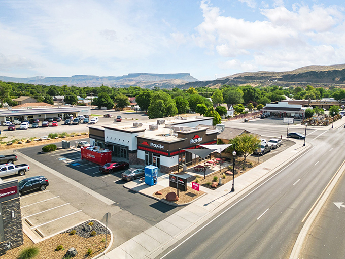 Hurricane's main drag might look ordinary until you notice those extraordinary red mountains standing guard in the background.