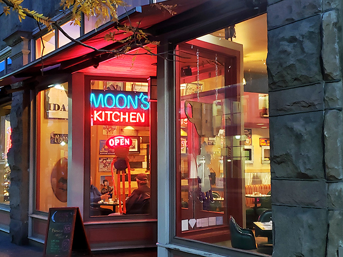 Moon's Kitchen glows with vintage neon promise. That warm light spilling onto the sidewalk is basically a breakfast beacon.