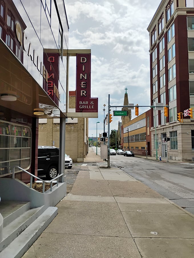 The Quarrier Diner's vintage neon sign glows with promises of pancakes. Downtown Charleston's breakfast landmark stands proud against the skyline.