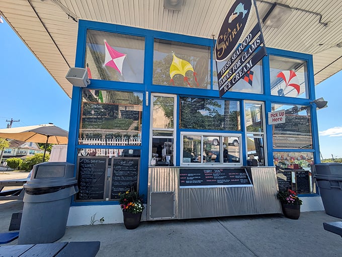Sea Swirl's blue facade stands out like a beacon for seafood lovers. Those colorful kites in the window hint at the playful flavors inside.