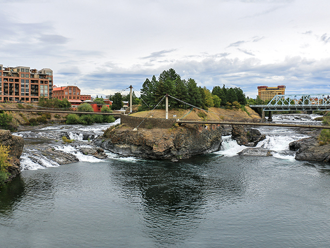 Spokane's dramatic falls create nature's heartbeat right downtown, where water crashes over ancient basalt formations.