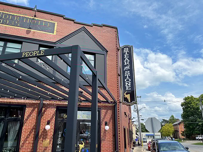 The Alexander Hotel's brick facade houses Steak & Stone. This 1935 building has found new life as Leitchfield's premier spot for sizzling steaks.