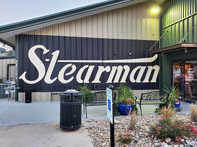 Stearman Field's sign is understated, but the experience is anything but&mdash;where else can you watch Cessnas land while munching on wings?