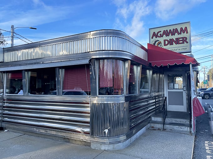 Agawam Diner's gleaming stainless steel exterior catches sunlight like a mirror, reflecting decades of breakfast perfection within.