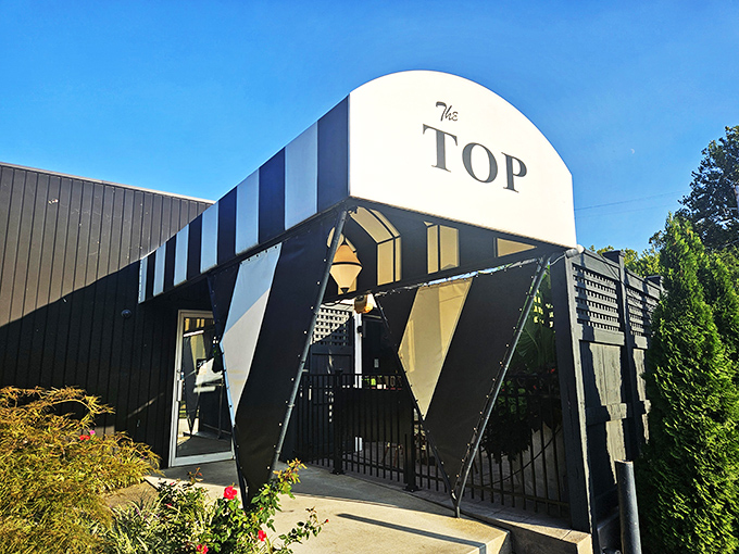 The Top's bold black and white awning announces itself like a tuxedo at a backyard barbecue&mdash;classic and unforgettable.