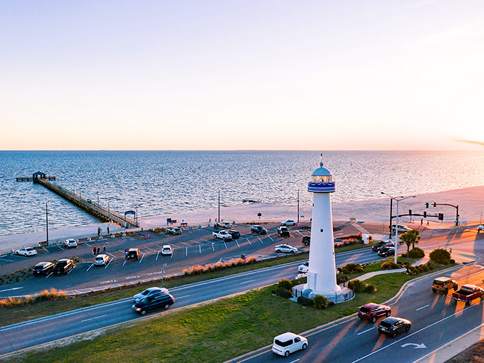 Sunrise over Biloxi's lighthouse &ndash; daily shows like this come free with your reasonably-priced coastal retirement.
