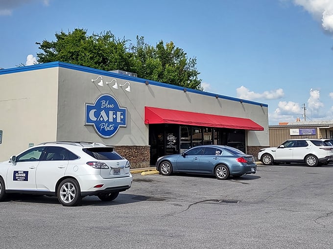 The Blue Plate Cafe stands ready to serve, its bright sign a morning lighthouse guiding the breakfast-starved to safety.
