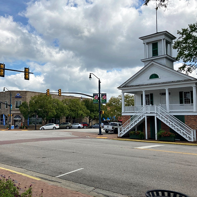 White church steeples and brick storefronts create Cheraw's timeless backdrop for daily life in this peaceful community.