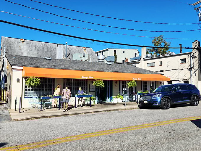 The orange awning signals you've arrived at a place where calories don't count and coffee refills are considered a constitutional right.