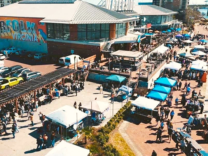 Fashion finds under blue skies! Norfolk's outdoor market displays vintage clothing with flair, turning secondhand shopping into a stylish adventure.