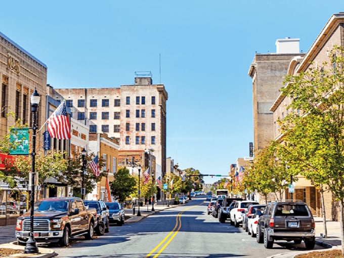 Enjoy a sunny afternoon exploring Gastonia&rsquo;s historic downtown, where classic architecture and waving flags create a welcoming, all-American small-town atmosphere.
