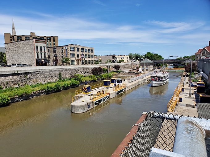 The Erie Canal literally splits Lockport in two, creating a picturesque scene where engineering marvel meets small-town charm.