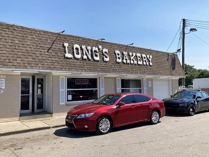 Long's Bakery signage: The humble brick exterior belies the extraordinary treats within. Sometimes legends look ordinary from the outside.