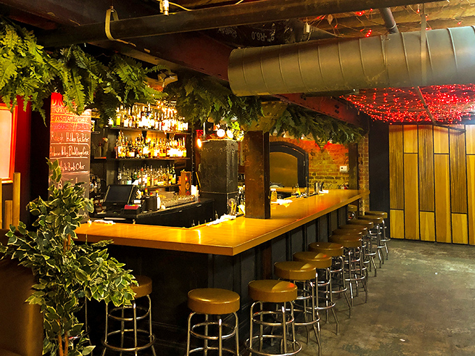 Neptune would approve of this subterranean sanctuary. Warm wood tones and hanging plants transform this bar into a cozy grotto.