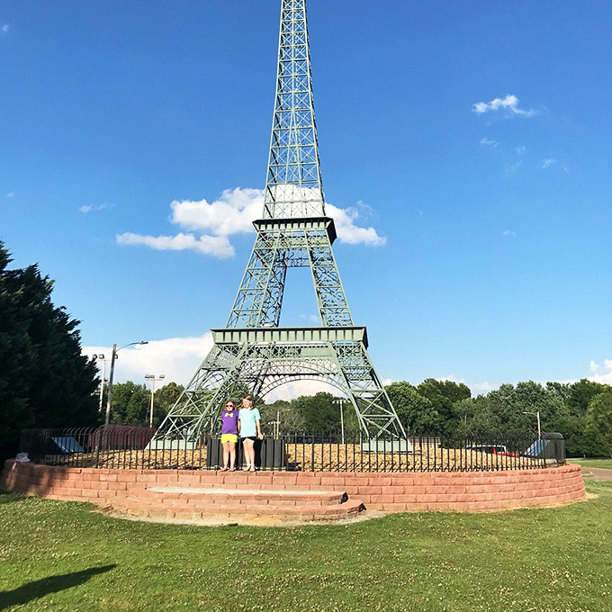 Paris, Tennessee's Eiffel Tower replica stands tall against blue skies. French-inspired charm at Tennessee prices&mdash;c'est magnifique for your retirement budget!