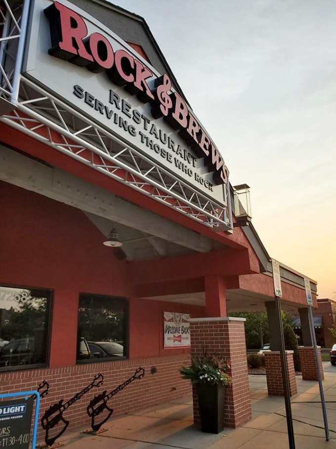 Concert lighting and guitar silhouettes create Rock & Brews' distinctive vibe. Come for the music memorabilia, stay for the perfect burger-and-beer harmony.