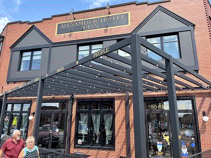 Steak & Stone's modern awning contrasts with historic brick. Like finding an old friend with a stylish new haircut &ndash; familiar comfort with contemporary flair.