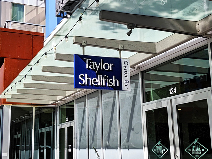 Sleek and sophisticated, Taylor Shellfish brings oyster farm freshness to the city. That blue sign promises shellfish heaven!