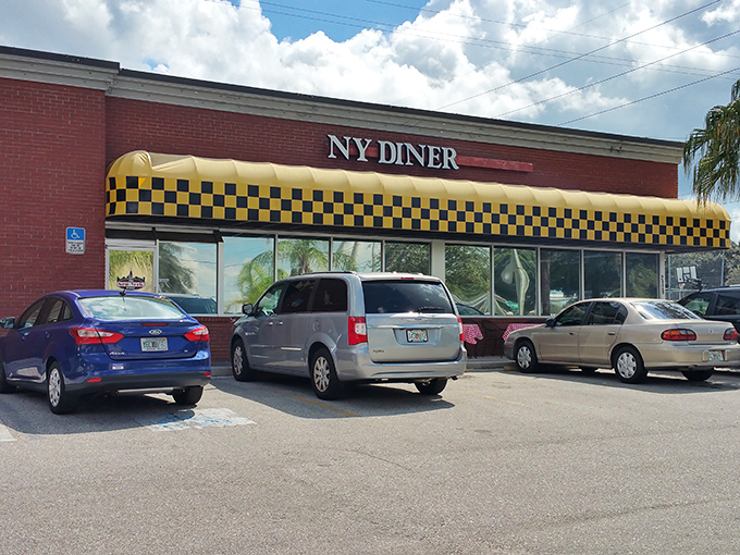 That yellow and black checkered awning is like a beacon calling hungry travelers to breakfast paradise.