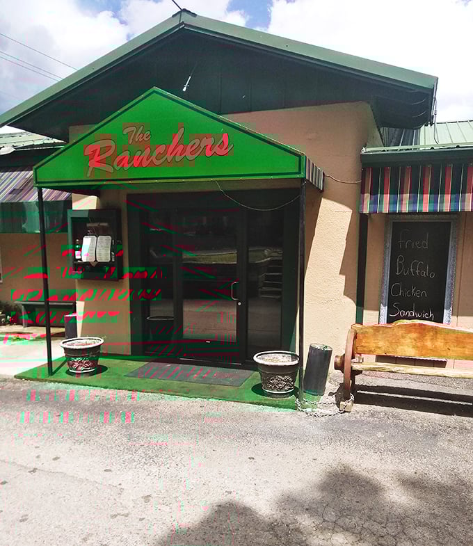 Simple exterior, extraordinary steaks—The Ranchers knows where to put its energy. That bright green sign points to beef paradise.