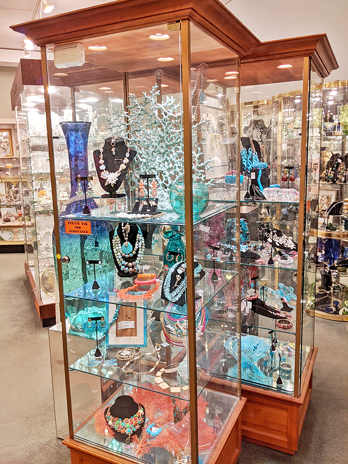 A jewelry display case that rivals museum exhibits. These gleaming treasures await their second act, each piece carrying whispers of special occasions past.