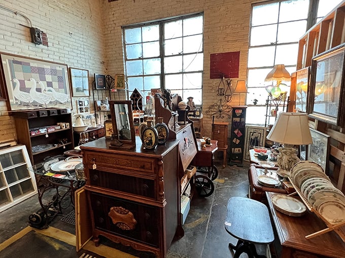 Antique furniture arranged like a living room from another era. That oak dresser has witnessed more history than your high school textbook.