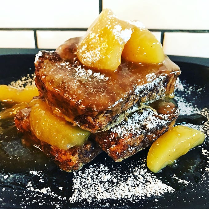 Apple fritter French toast that makes you wonder if Eve's temptation in the Garden involved maple syrup and powdered sugar too.