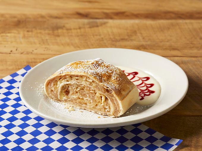 Apple strudel that would make your grandmother weep with joy, dusted with powdered sugar like the first perfect snowfall of winter.
