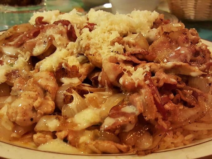 Arroz con pollo elevated to an art form – where chicken and rice aren't just dinner staples but a canvas for flavor that puts ordinary weeknight meals to shame.