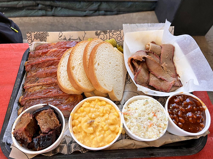 Ribs and brisket sharing a plate like old friends at a reunion. That smoke ring is the barbecue equivalent of a designer label.