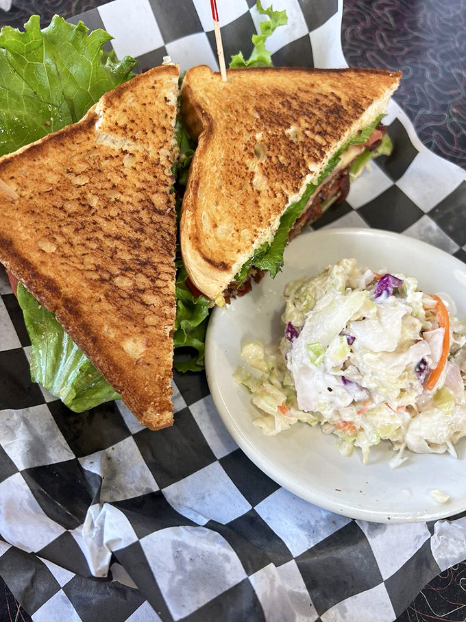 The humble BLT, elevated to art form. Perfectly toasted bread, garden-fresh ingredients, and a side of creamy coleslaw that doesn't skimp.