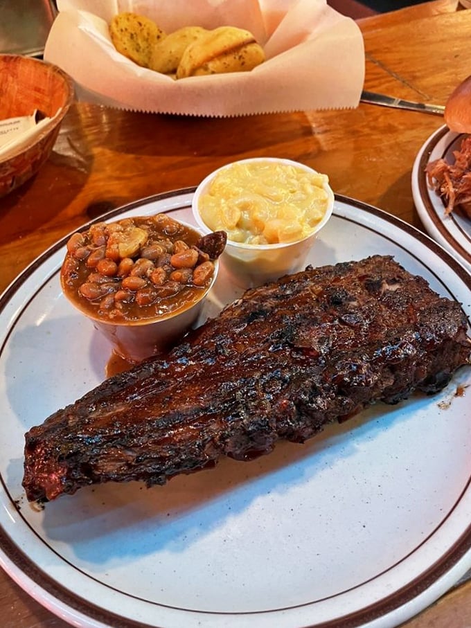 Dry-rubbed ribs with that beautiful bark exterior tell you someone in the kitchen understands the sacred art of patience. The beans and mac look like worthy sidekicks.
