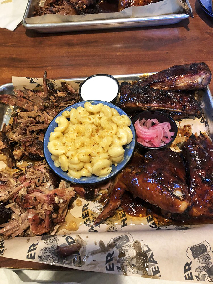 BBQ artistry on full display. That mac & cheese center stage with pulled pork and ribs playing delicious supporting roles.